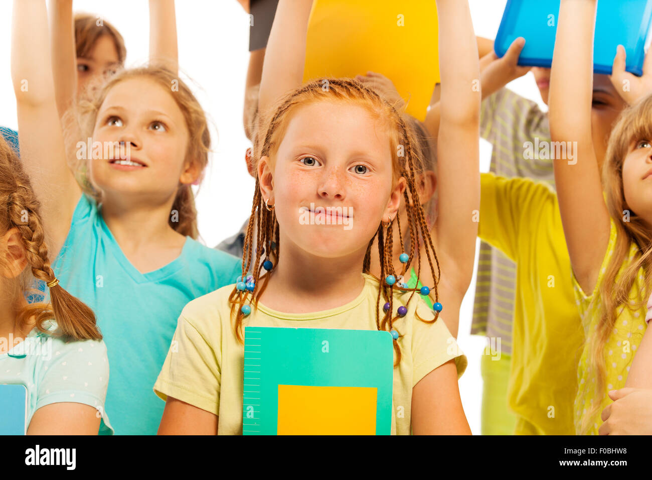Happy beautiful girl with textbook in the crowd Stock Photo - Alamy
