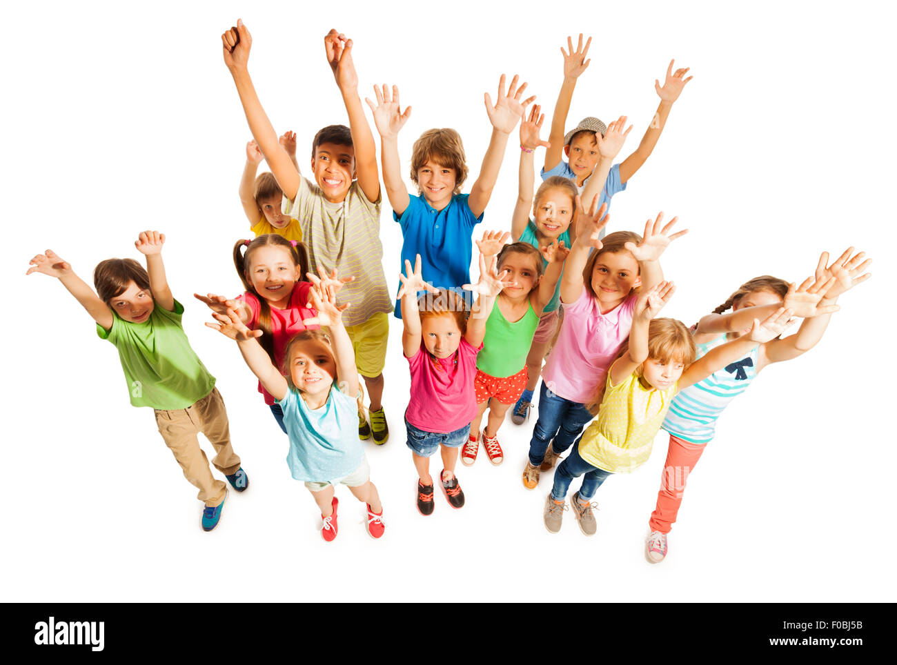 Many kids stand isolated on white in large group Stock Photo - Alamy