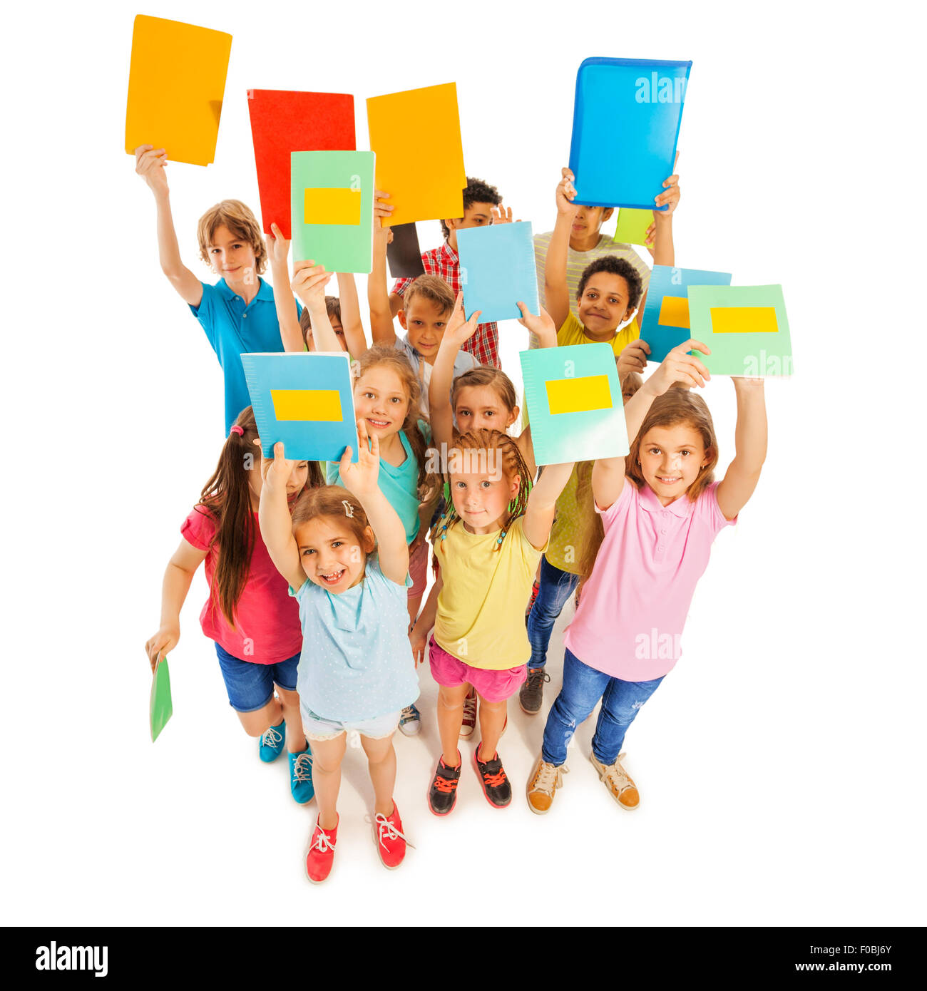 Cool and confident students lifting textbooks Stock Photo - Alamy