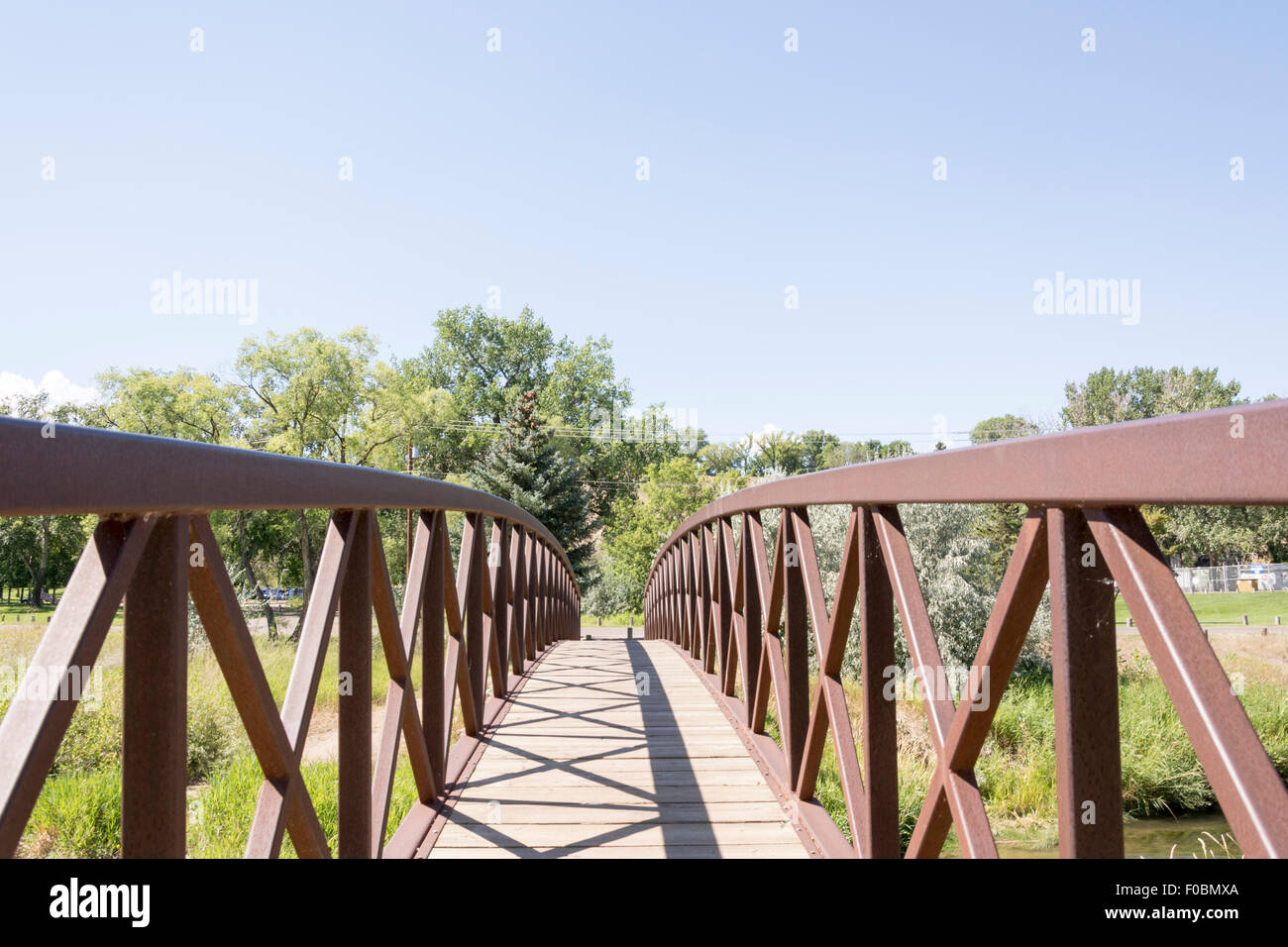 Looking across the walking bridge in Kin Coulee Park at Medicine Hat ...
