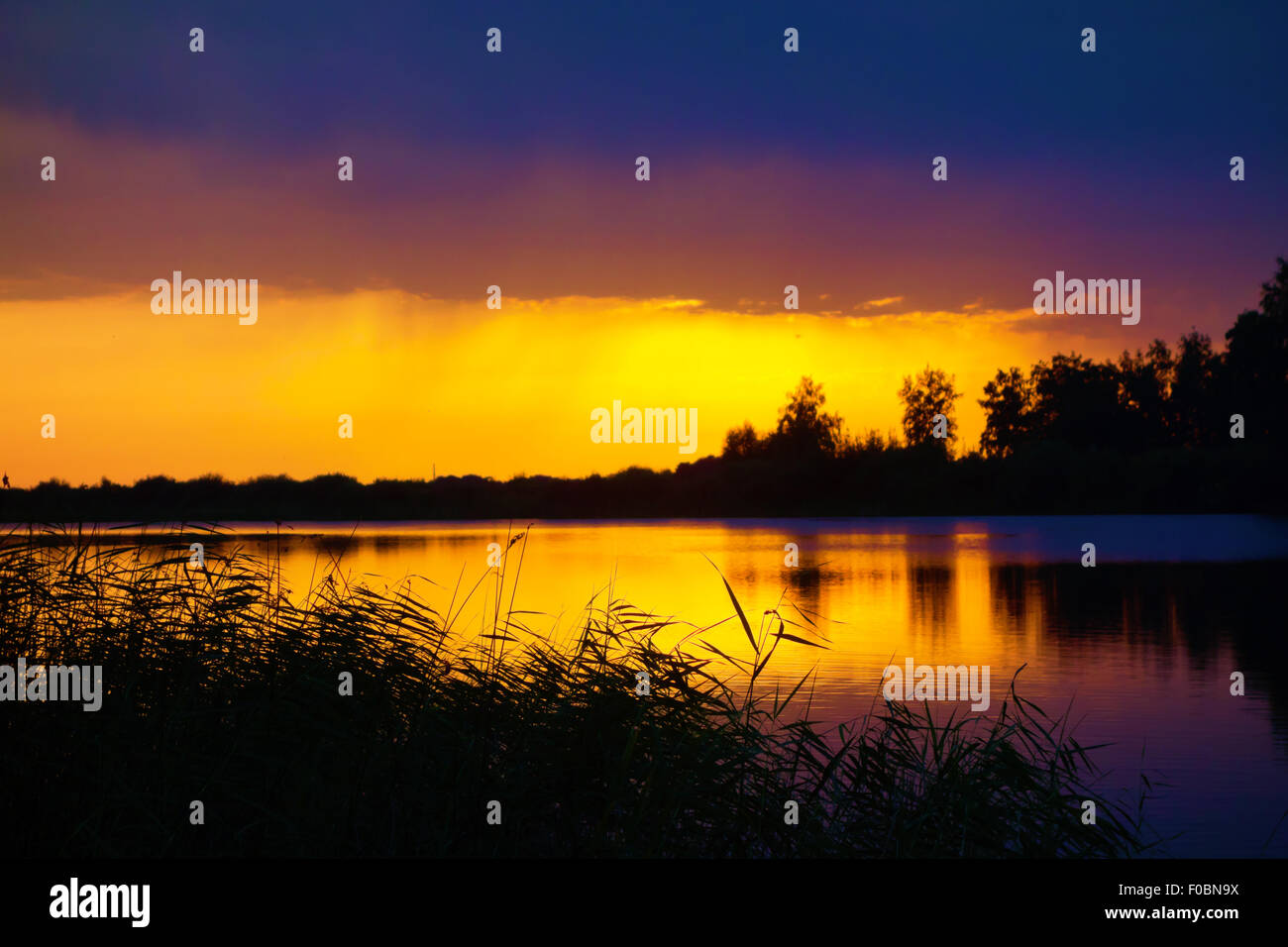 red sunset over lake Stock Photo - Alamy