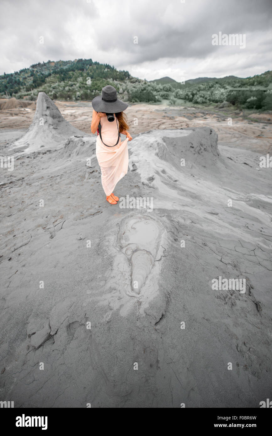 Female traveler walking near mud volcanoes Stock Photo - Alamy