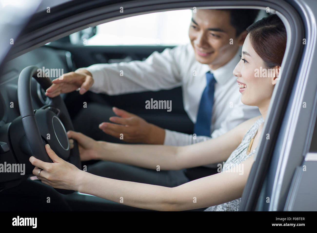 Young woman taking a test drive Stock Photo - Alamy