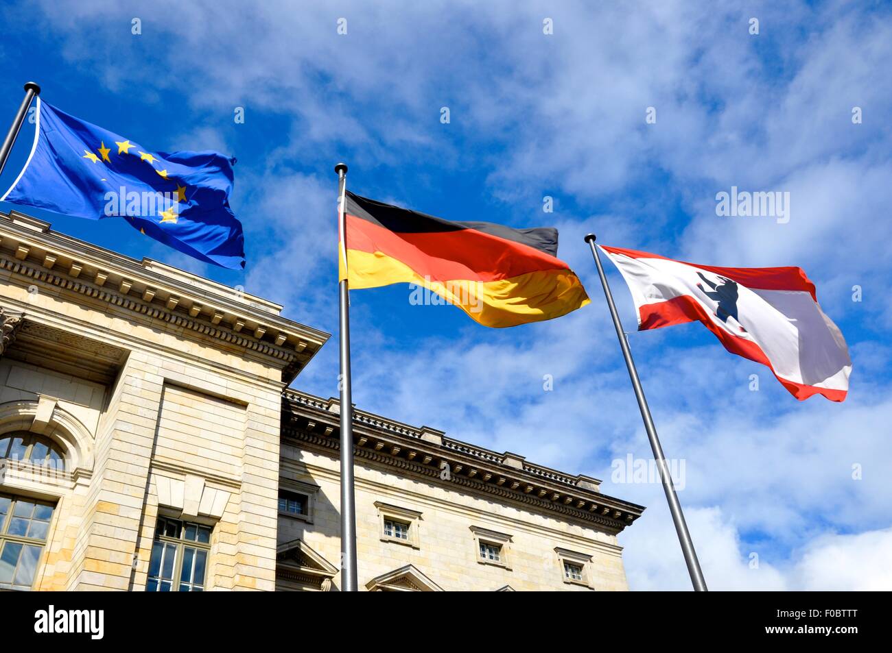 EU, Germany and Berlin flags outside the Reichstag parliament building ...