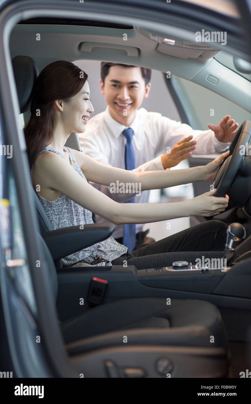 Young woman taking a test drive Stock Photo - Alamy