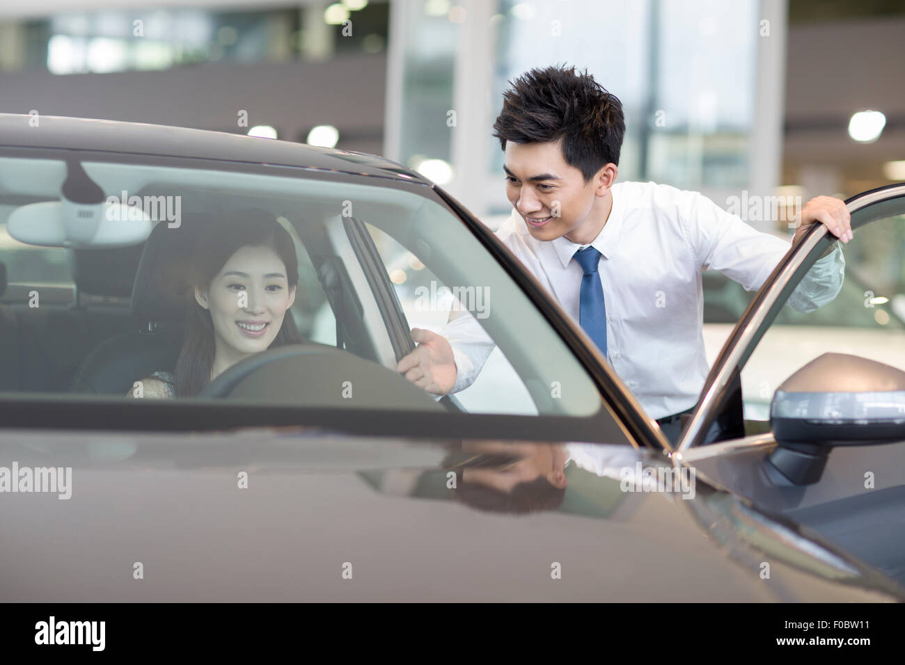 Young woman taking a test drive Stock Photo - Alamy