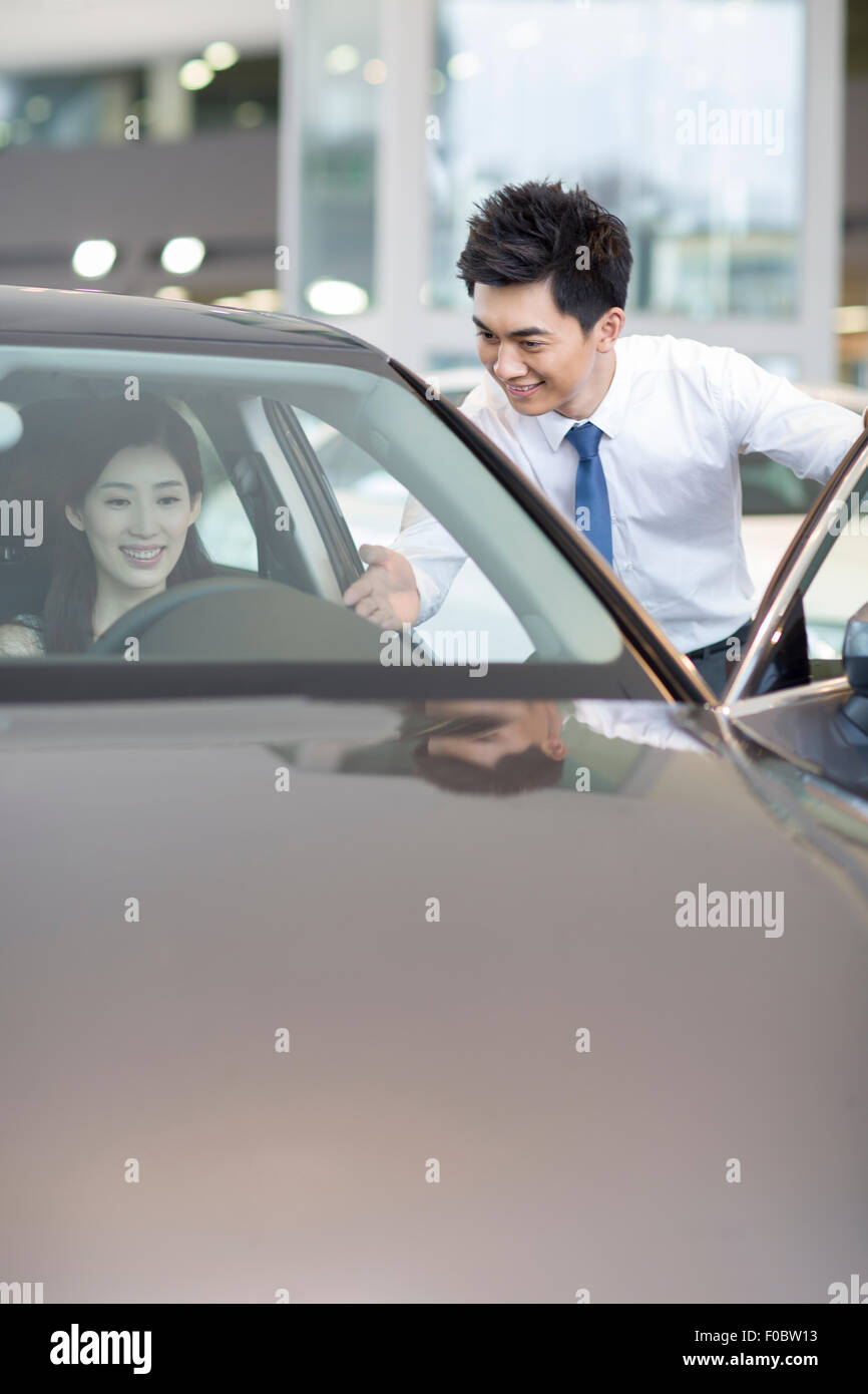 Young woman taking a test drive Stock Photo - Alamy