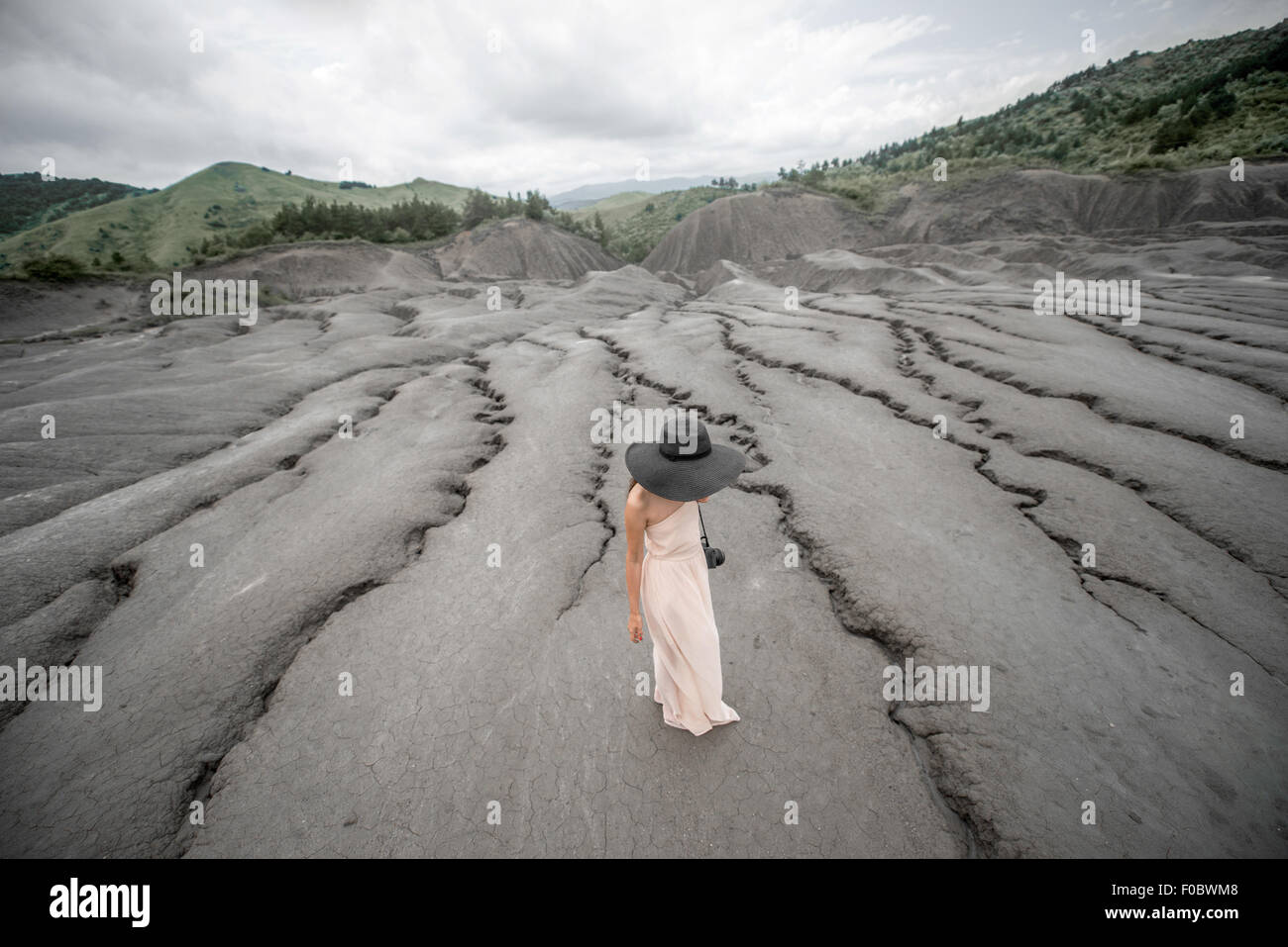 Female traveler near mud volcanoes Stock Photo - Alamy