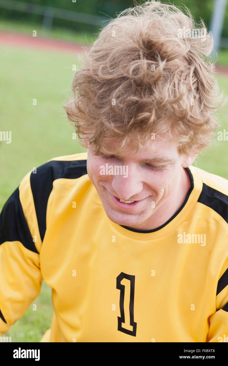 Smiling handsome soccer player hi-res stock photography and images - Alamy