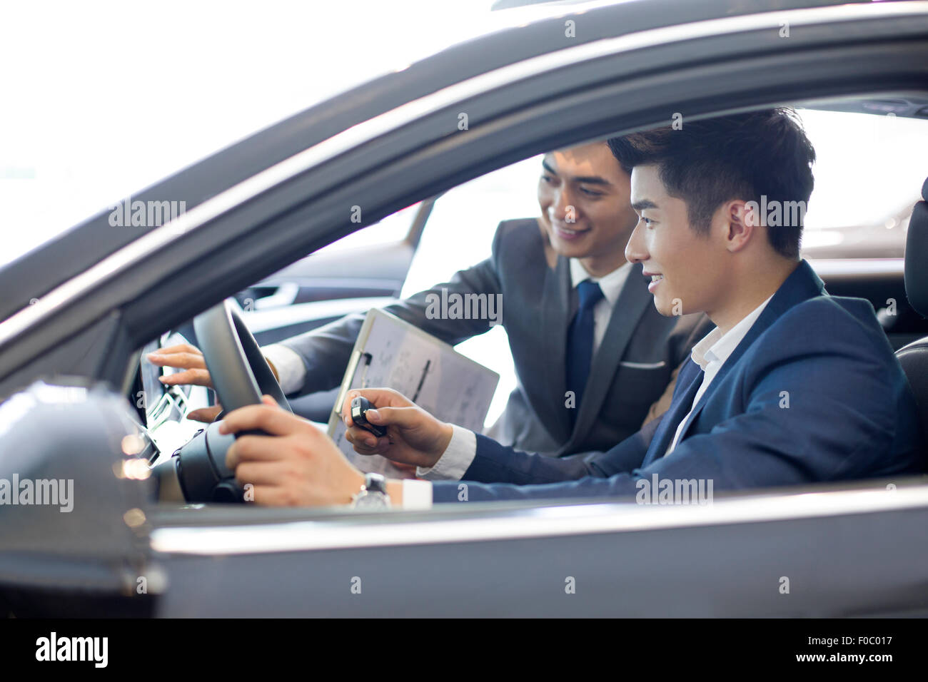 Young businessman taking a test drive Stock Photo - Alamy