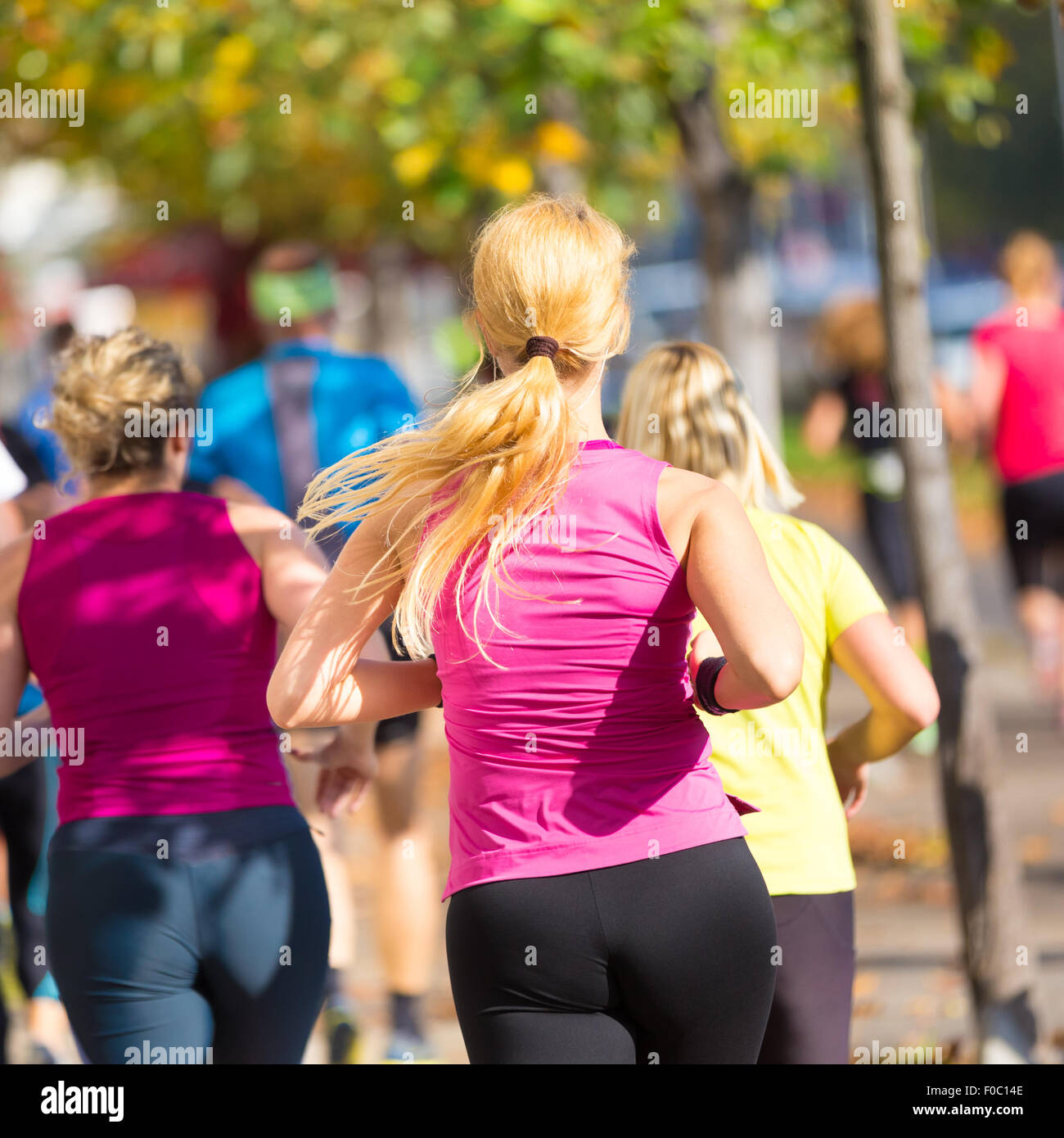 Group of people running Stock Photo - Alamy