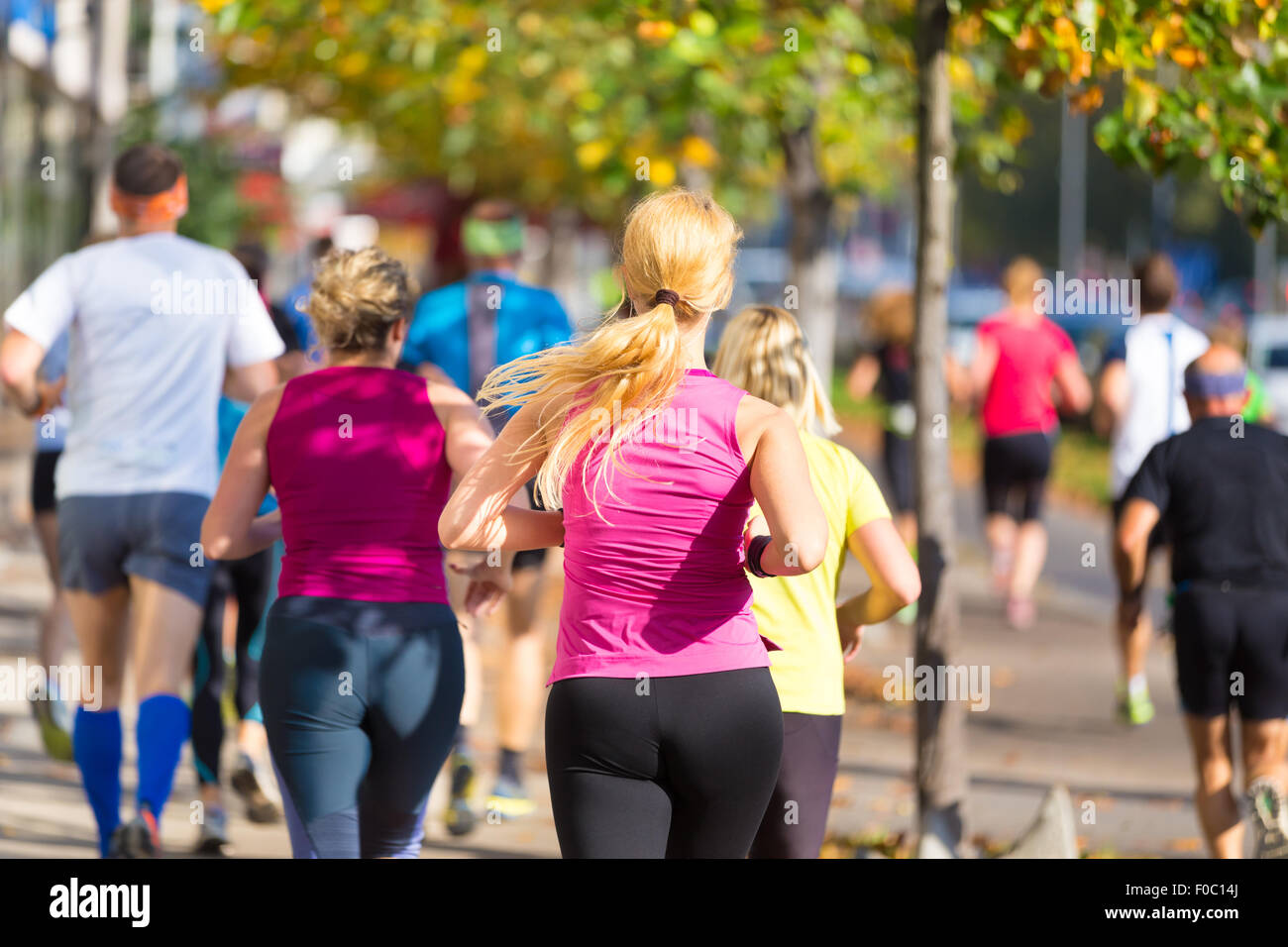 Group of people running Stock Photo - Alamy