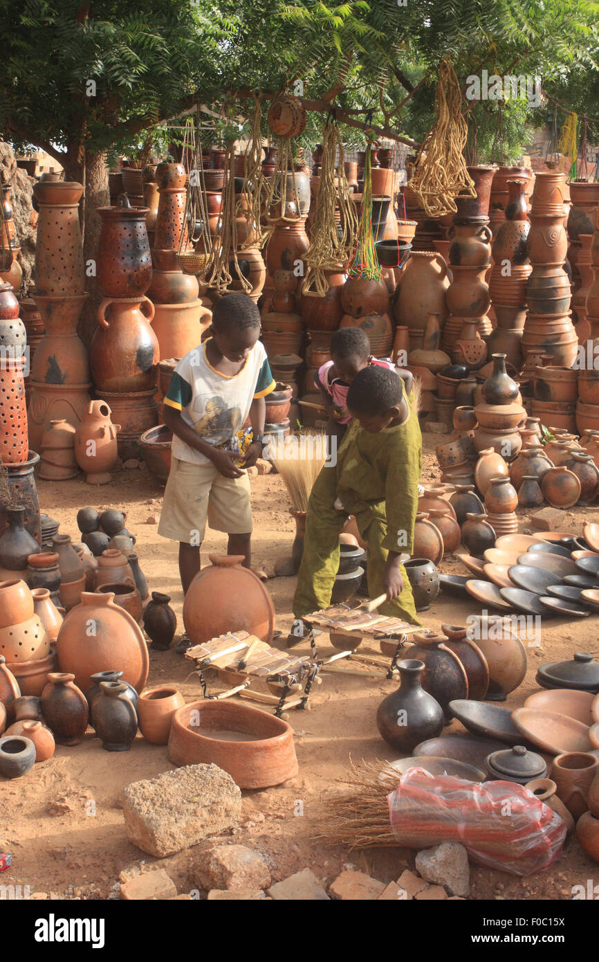 BANDIAGARA, MALI - OCTOBER 5, 2008: Unidentified children in a pottery ...