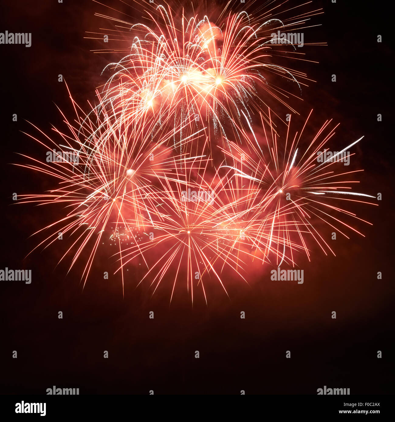 Red colorful fireworks on the black sky background Stock Photo - Alamy