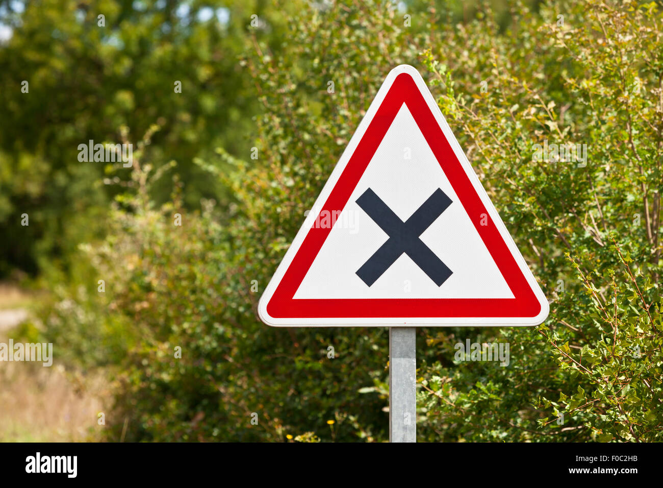 Crossroad intersection triangle traffic sign hi-res stock photography ...