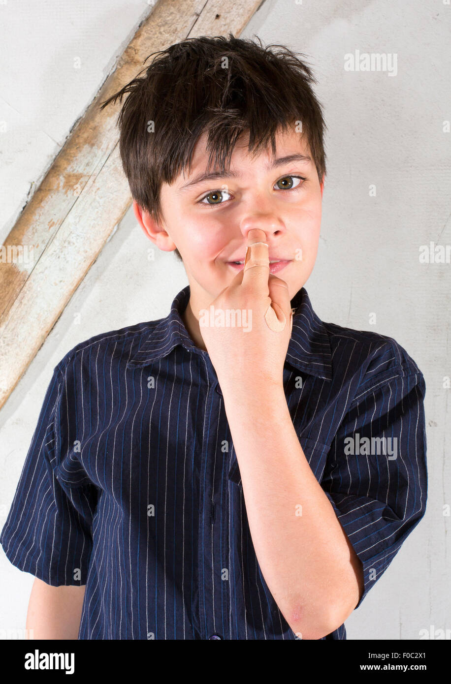 portrait of a young boy with his finger in his nose Stock Photo - Alamy