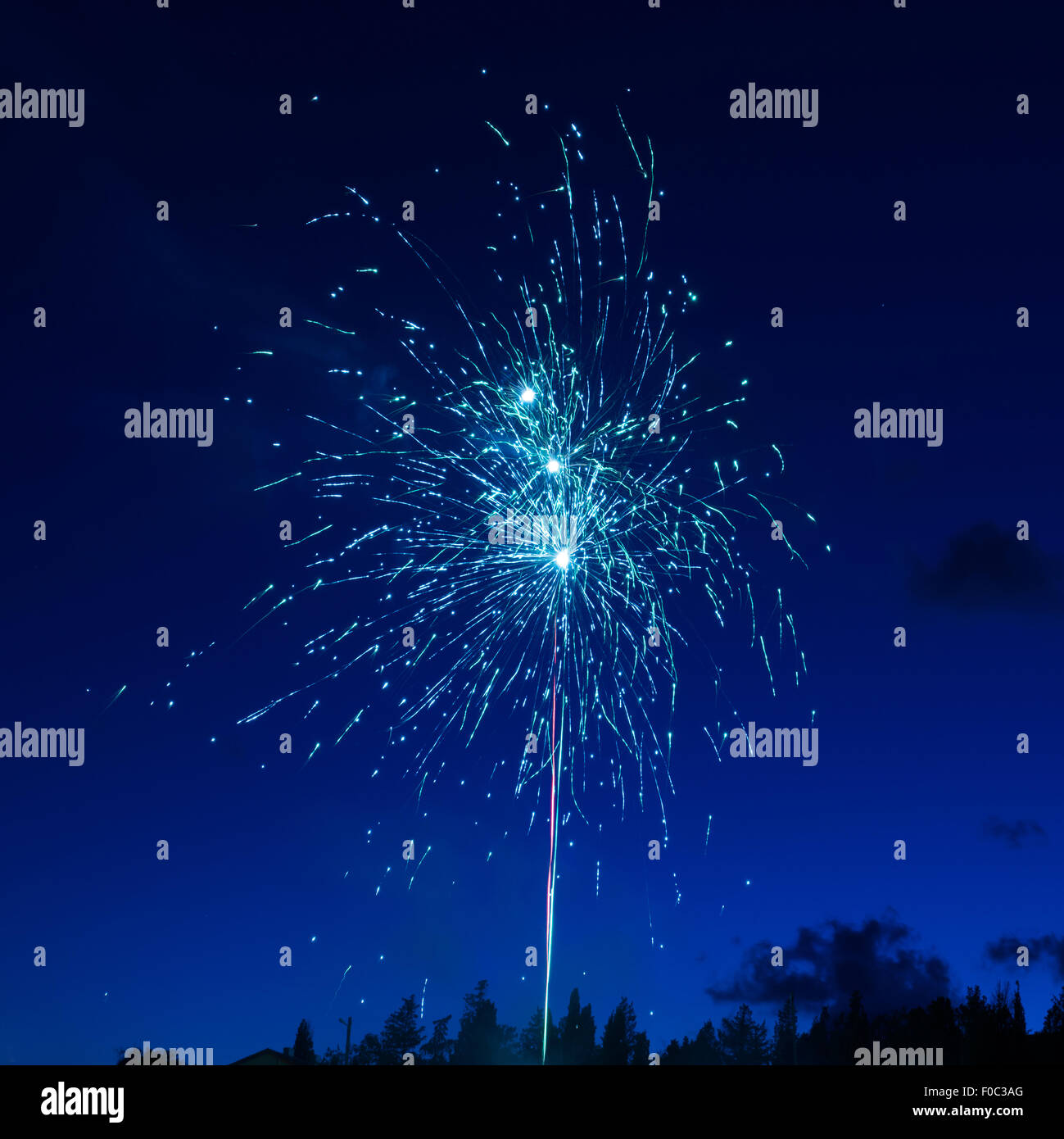 Blue colorful fireworks on night sky background Stock Photo - Alamy