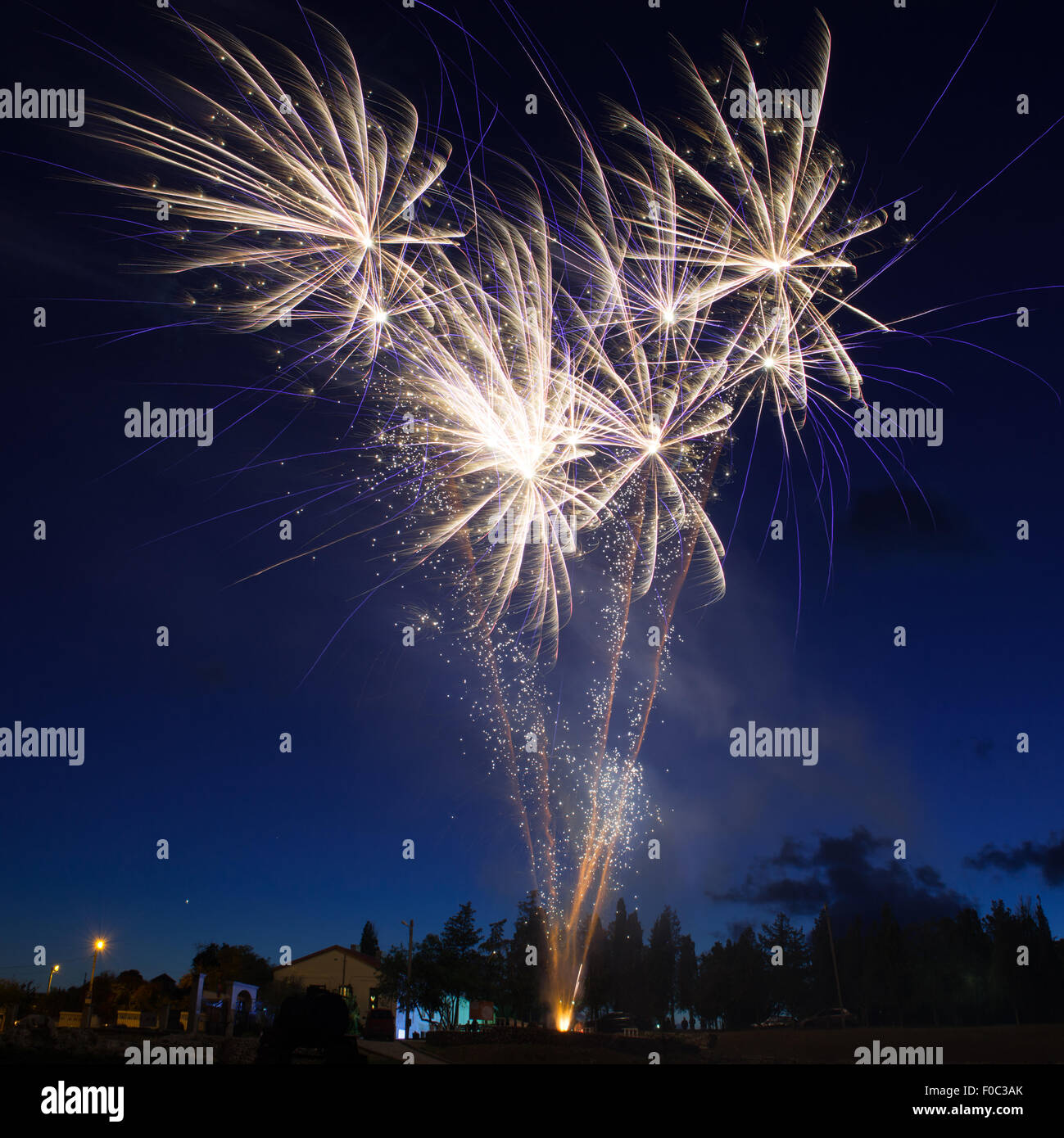 Blue colorful fireworks on night sky background Stock Photo - Alamy