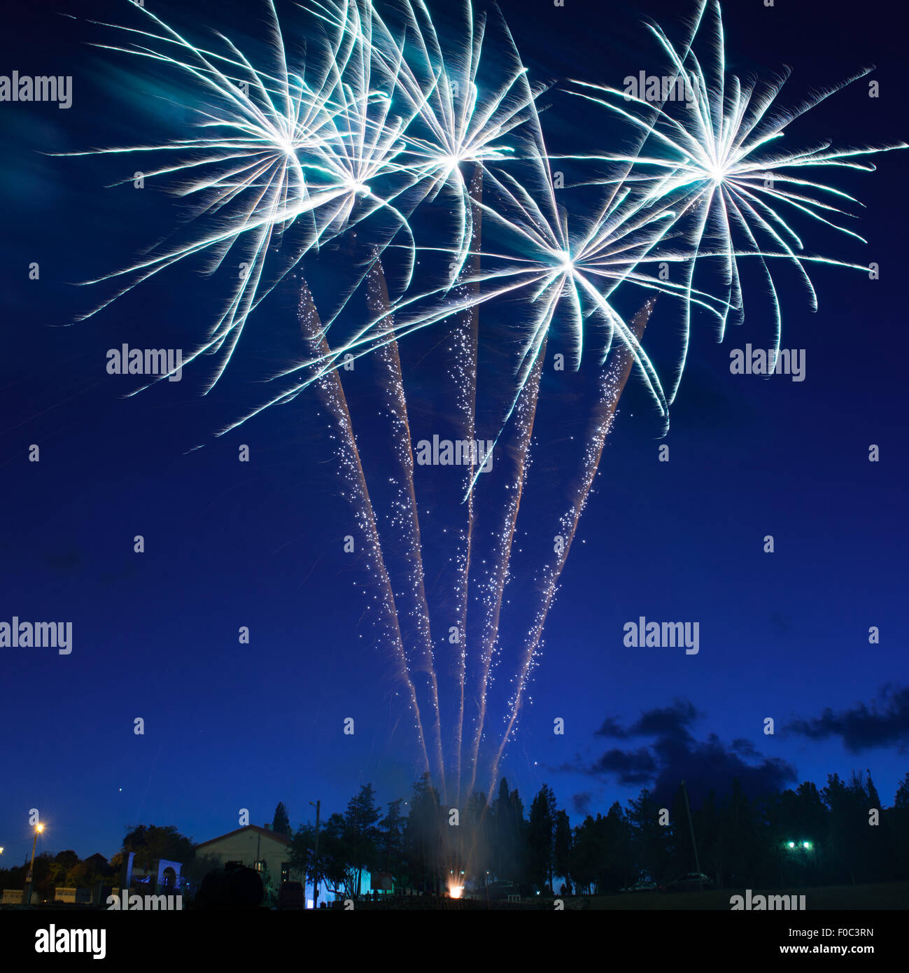 Blue colorful fireworks on night sky background Stock Photo - Alamy