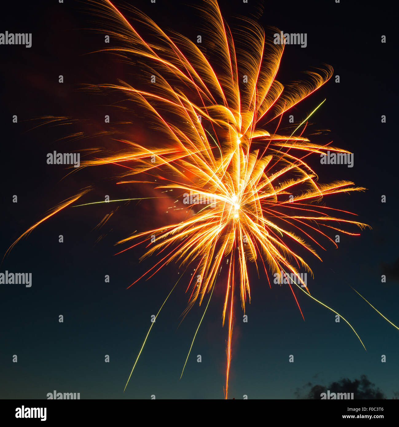 Red colorful fireworks on blue sky background Stock Photo - Alamy