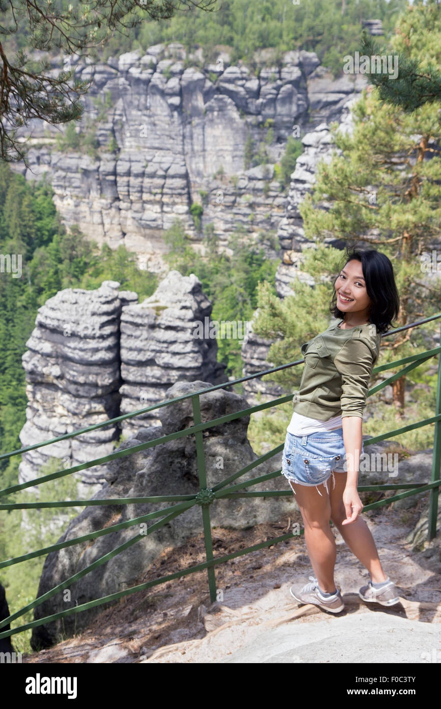 Woman on the lookout in nature Stock Photo - Alamy