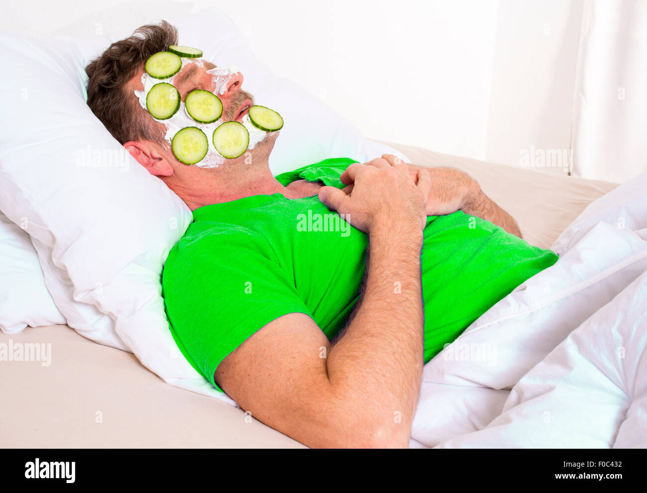 man in bed with facial and sleeping Stock Photo - Alamy
