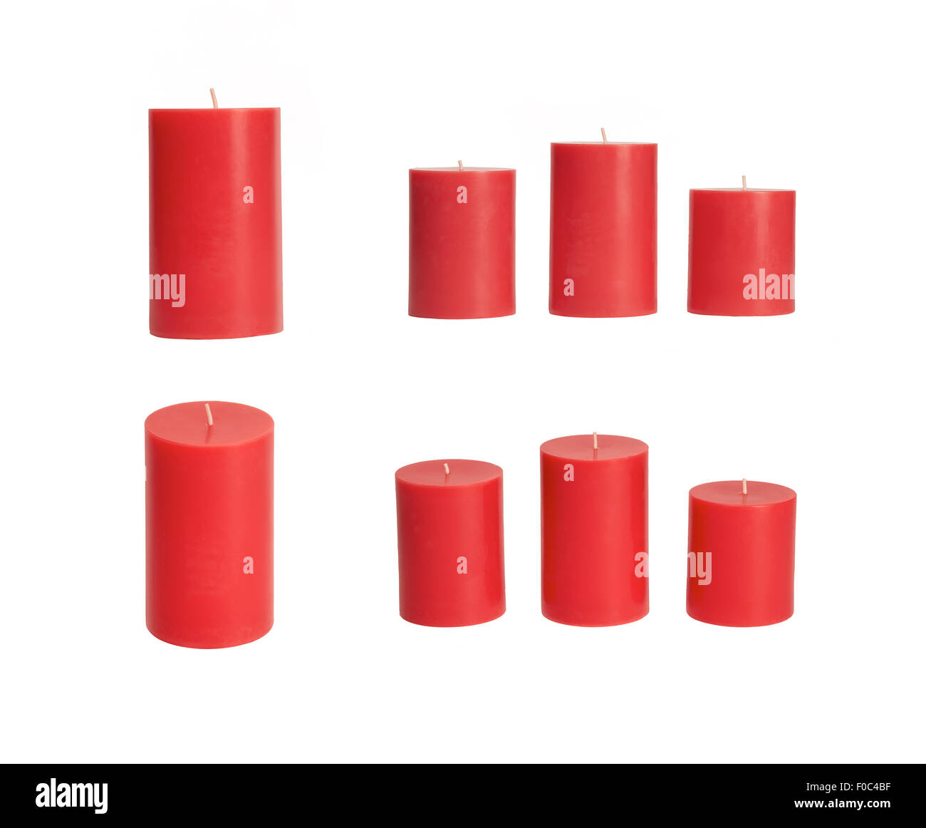 A selection of red candles at different angles on a white background ...