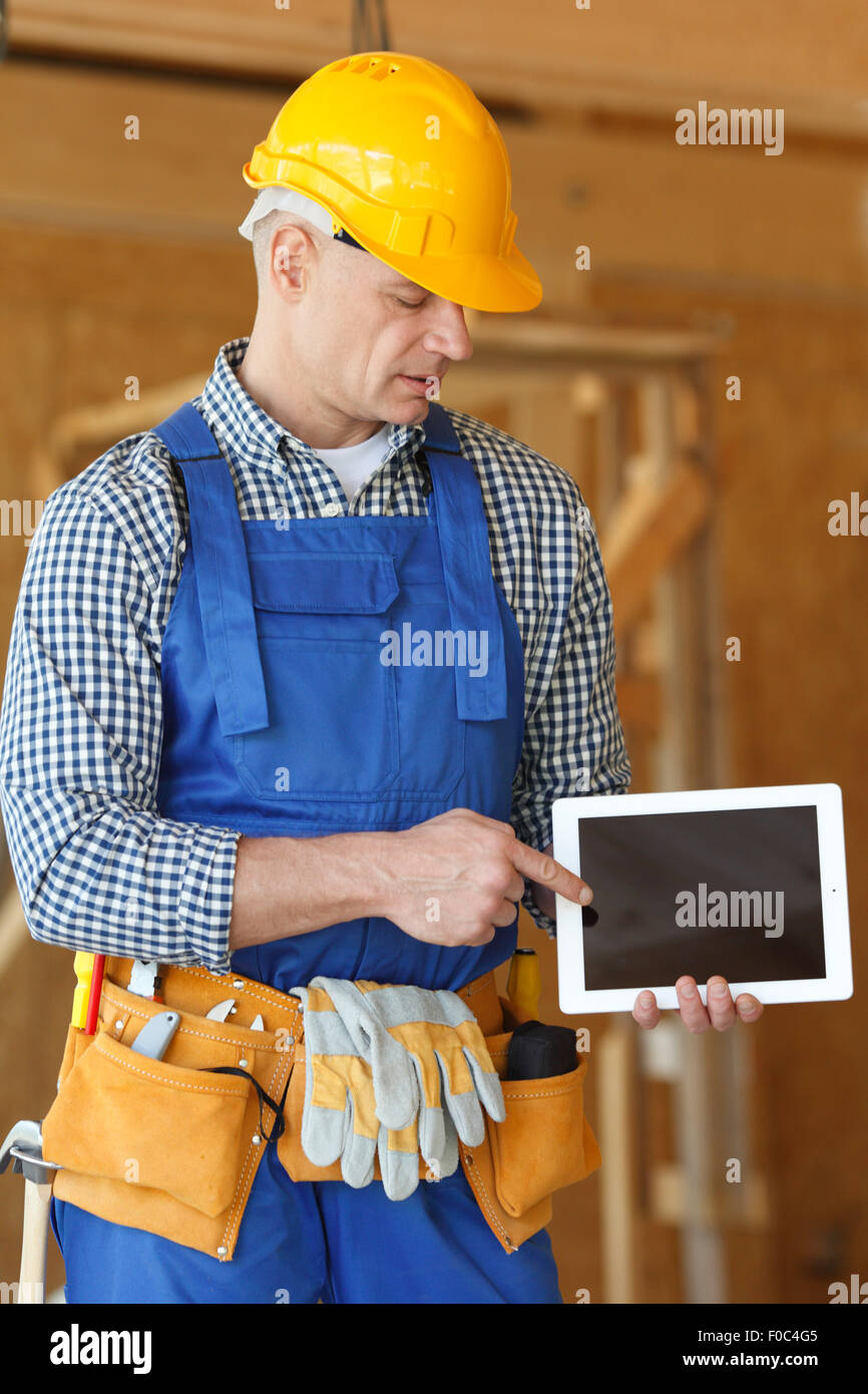 workman with tablet Stock Photo - Alamy
