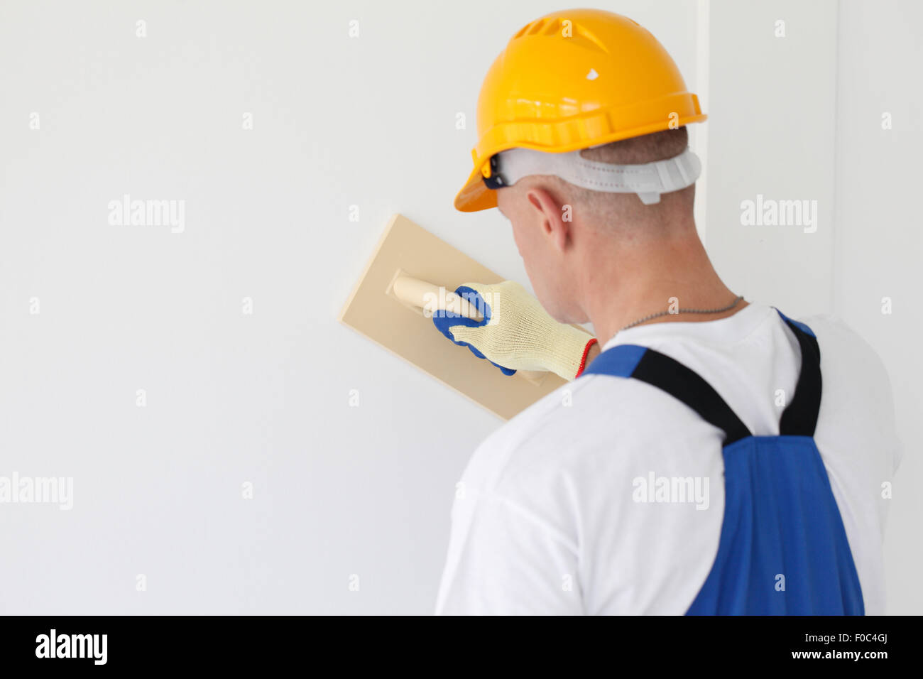 workman polishing wall Stock Photo - Alamy