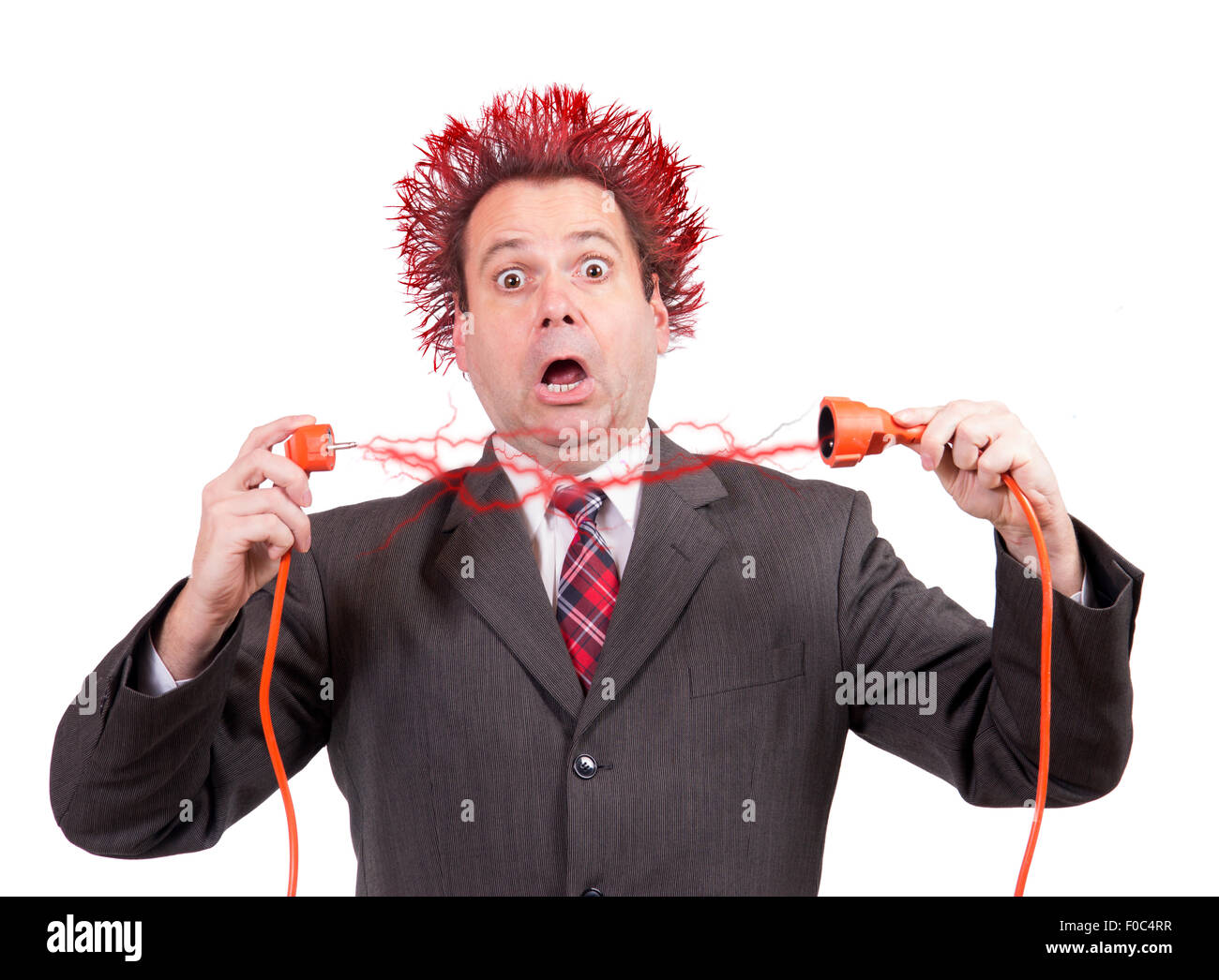businessman is shocked from sparks from an electric plug connector ...