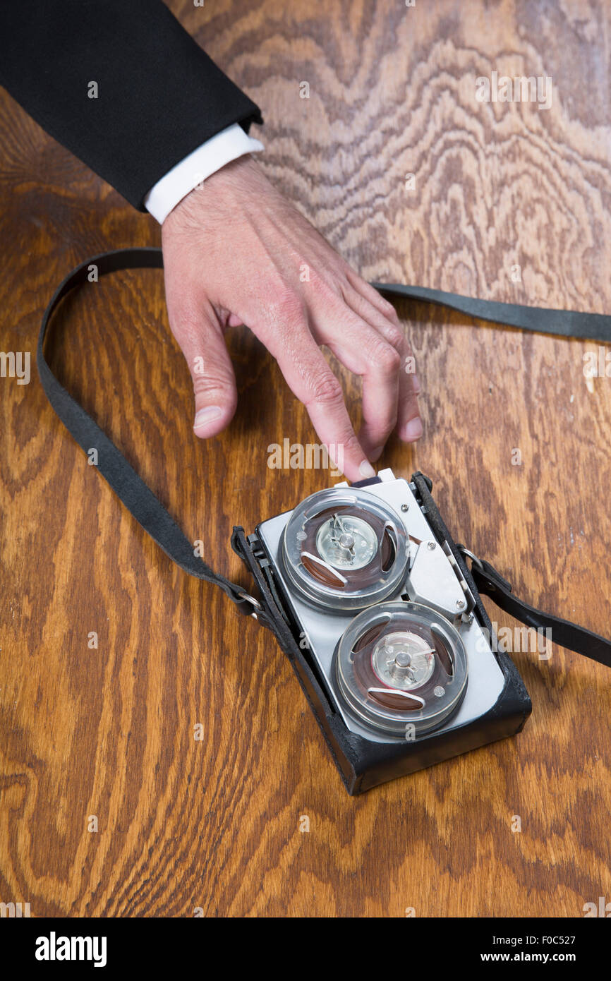 Cropped image of businessman using old-fashioned tape recorder on ...