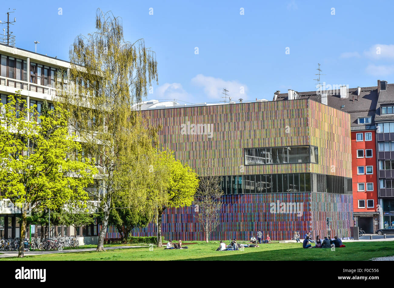The long two-storey rectangular building multi-coloured facade composed ...
