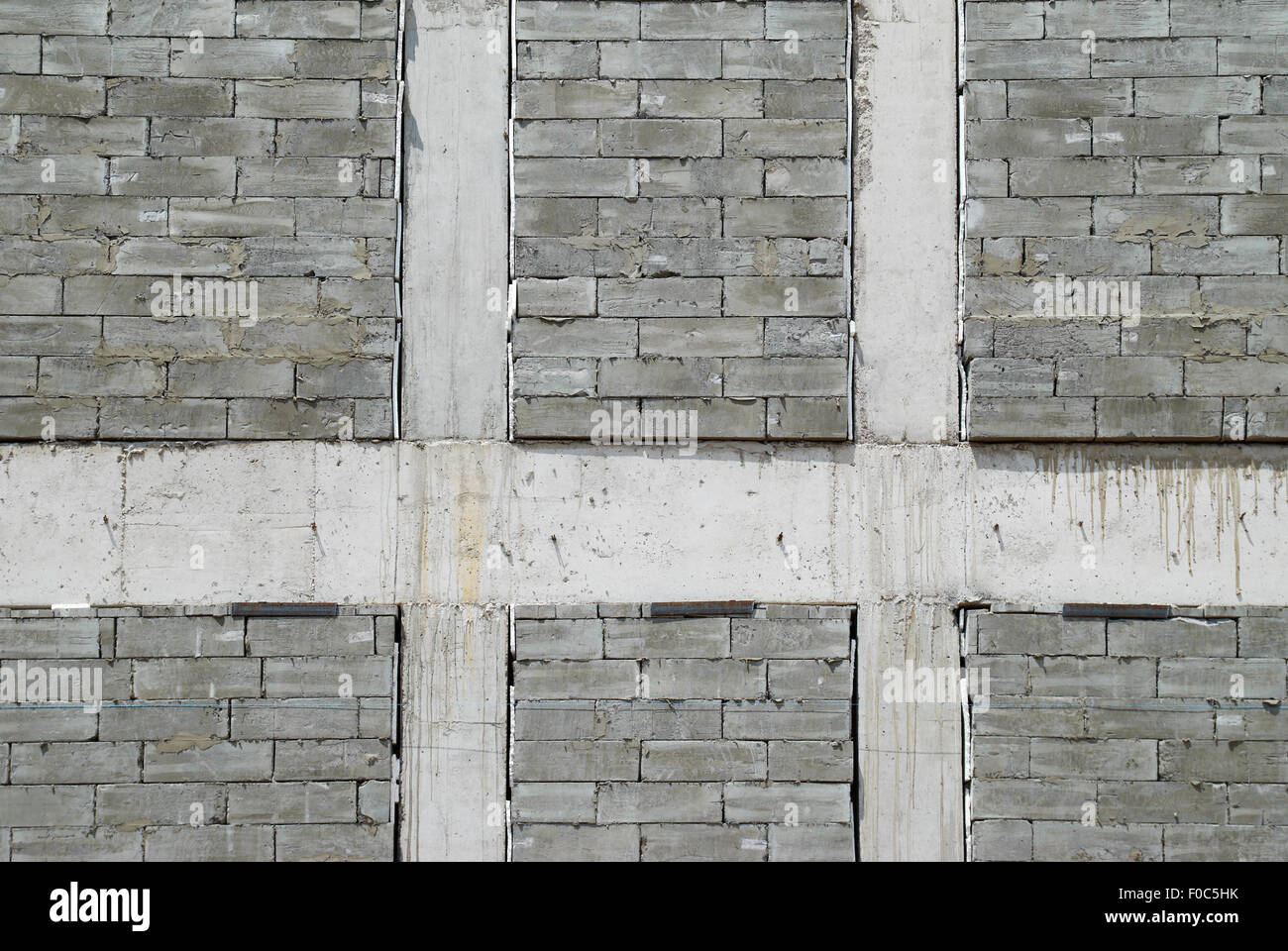A wall of textured gray construction bricks Stock Photo - Alamy