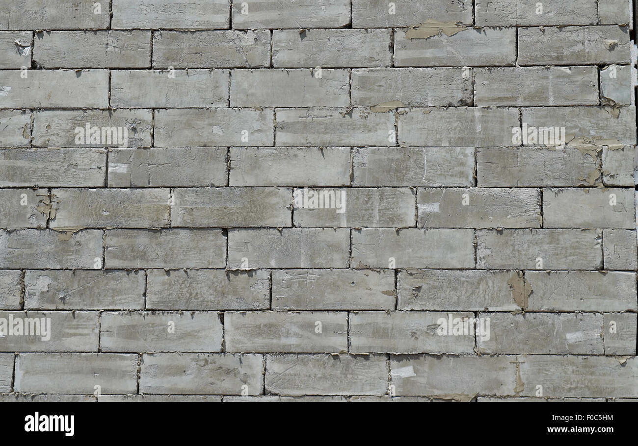 A wall of textured gray construction bricks Stock Photo - Alamy