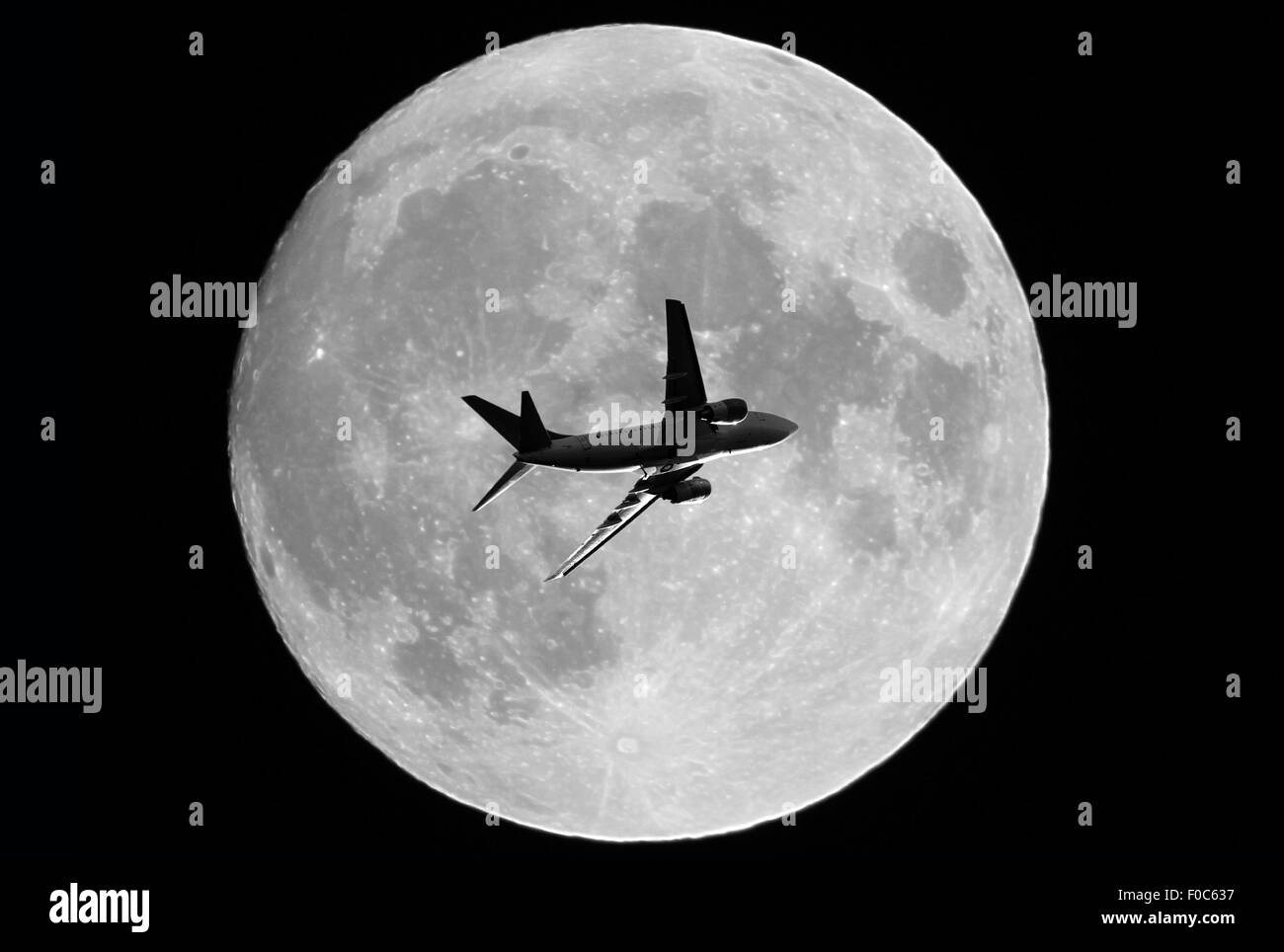 airplane and a full moon Stock Photo - Alamy