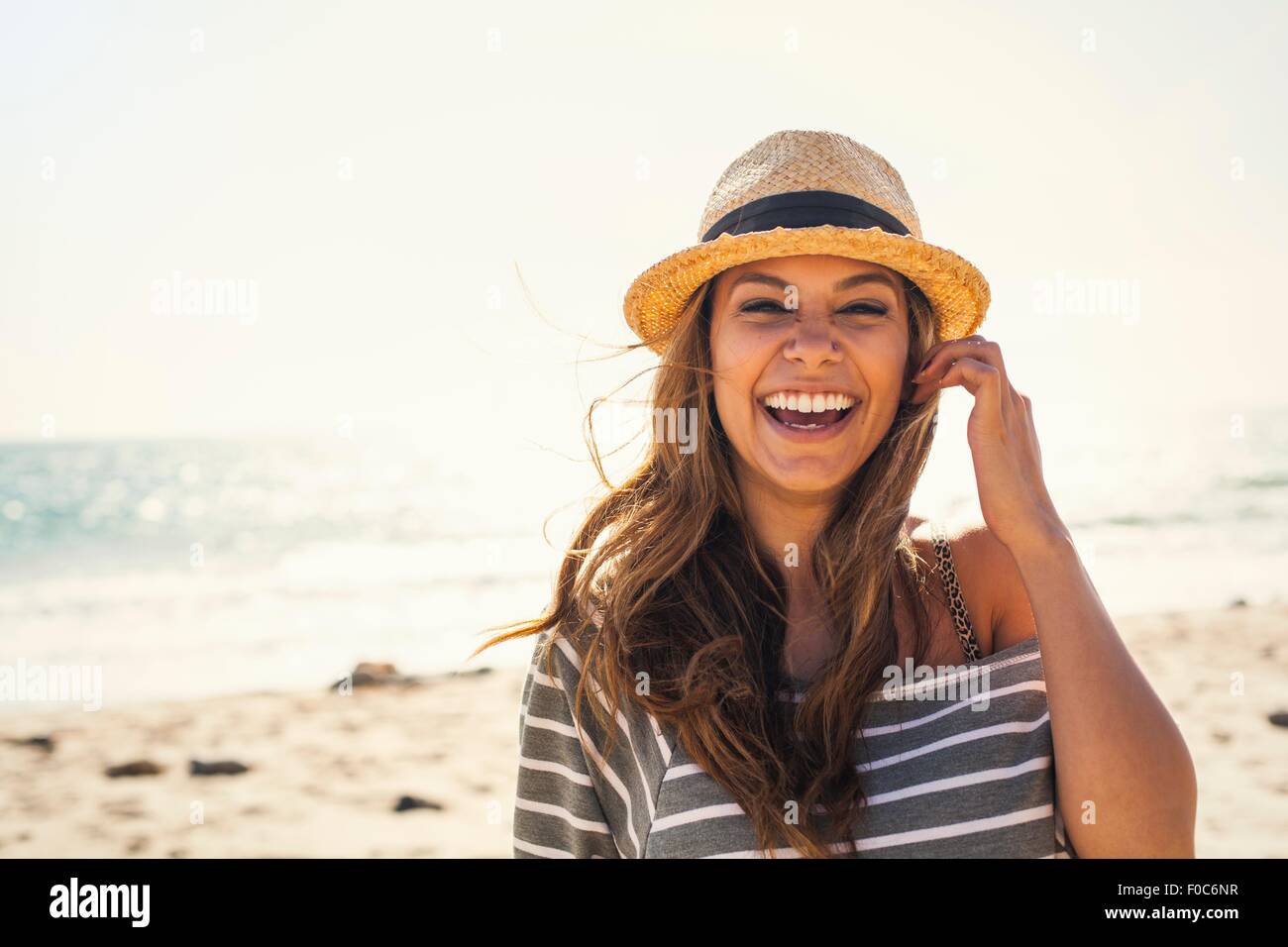 Woman young posing at on the beach hi-res stock photography and images ...