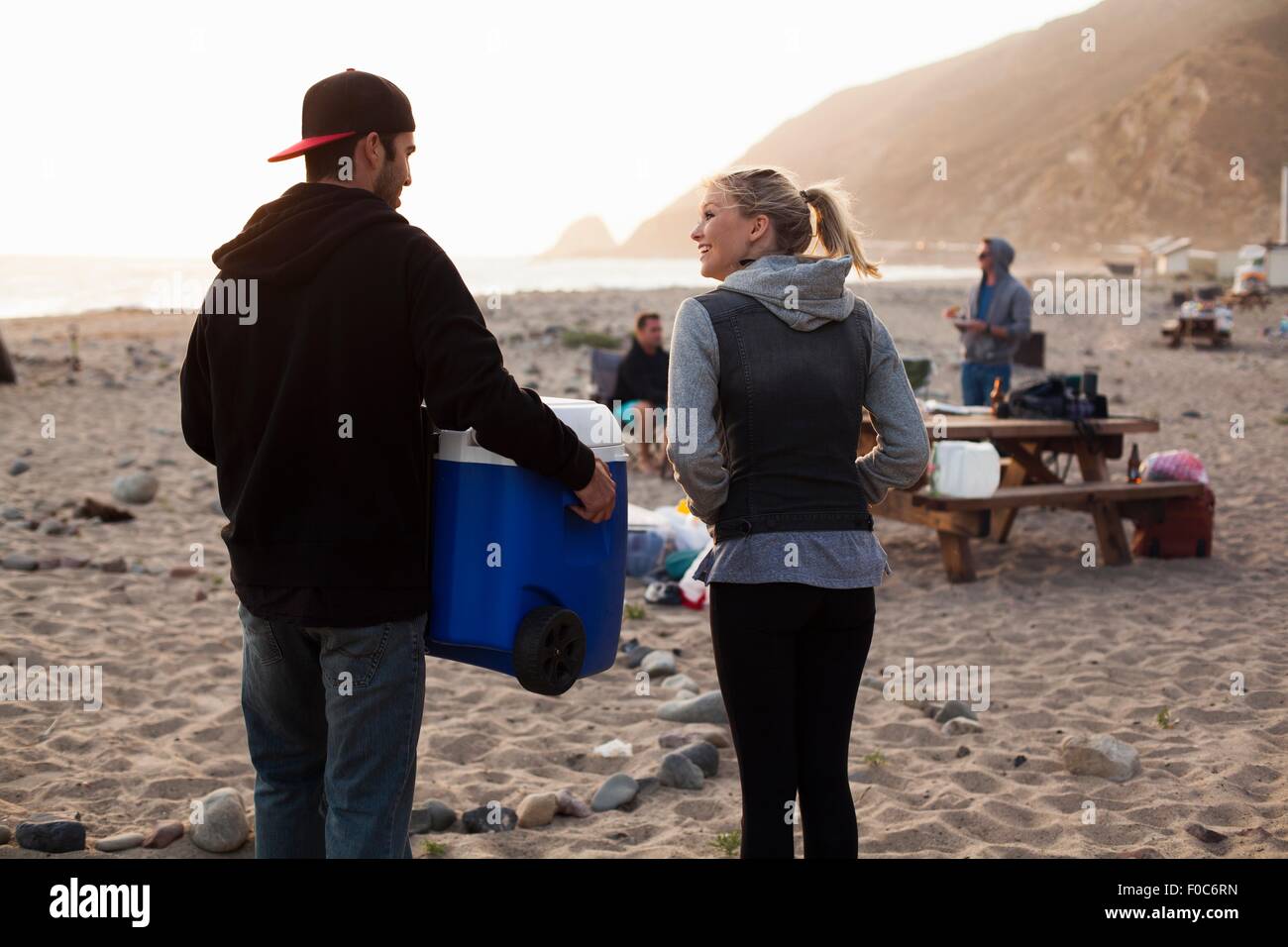 Group of friends camping on beach, Malibu, California, USA Stock Photo ...