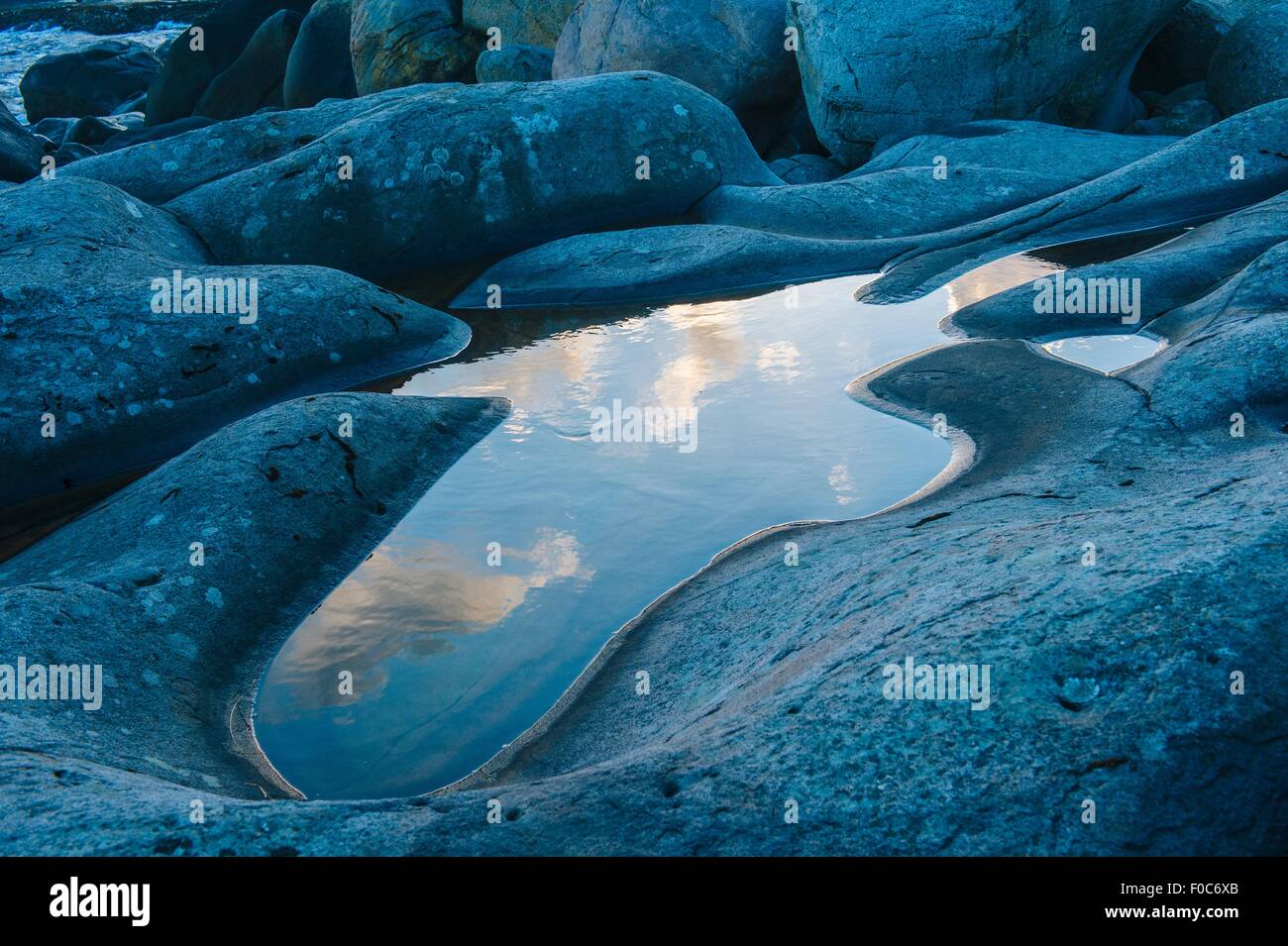 Rock pools reflecting blue sky hi-res stock photography and images - Alamy