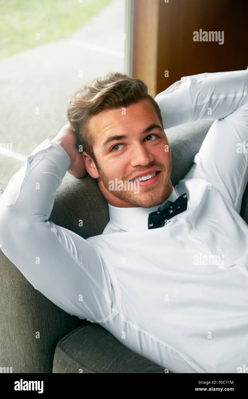 Portrait of man with hands behind head hi-res stock photography and ...