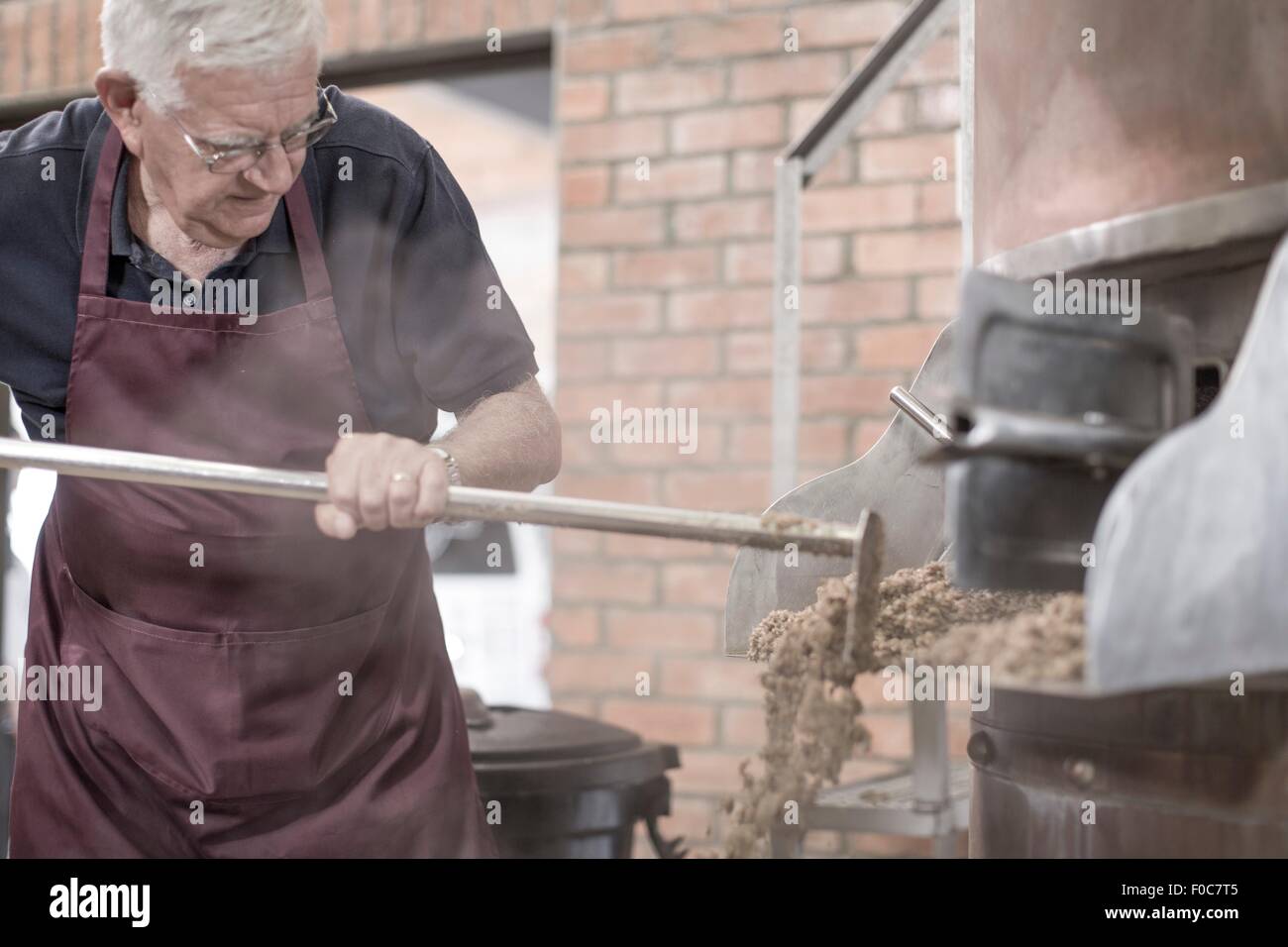 Brewer cleaning a copper kettle in the brewery Stock Photo - Alamy