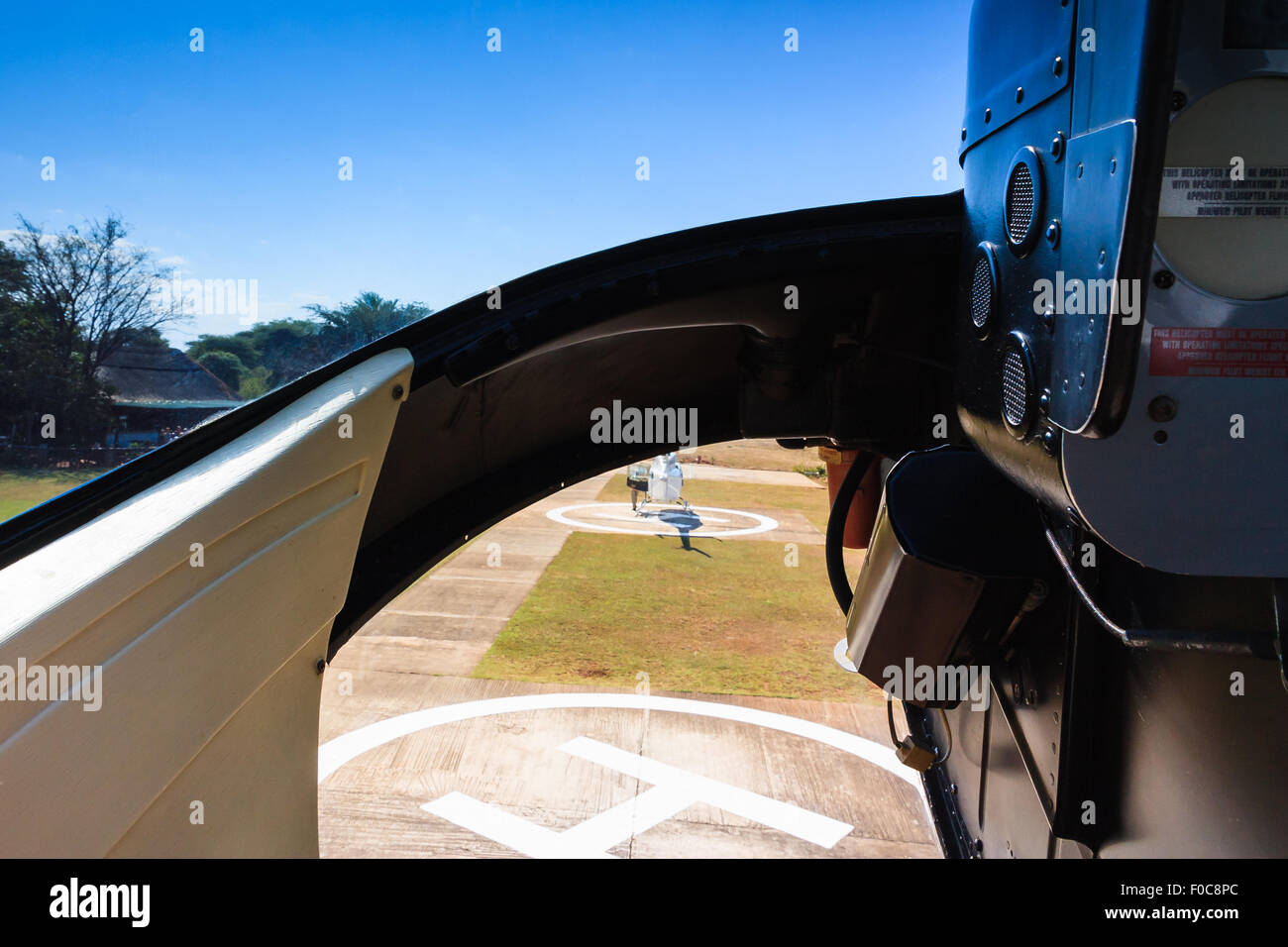 Helicopter landing from cabin. Helipad visible through glass Stock ...