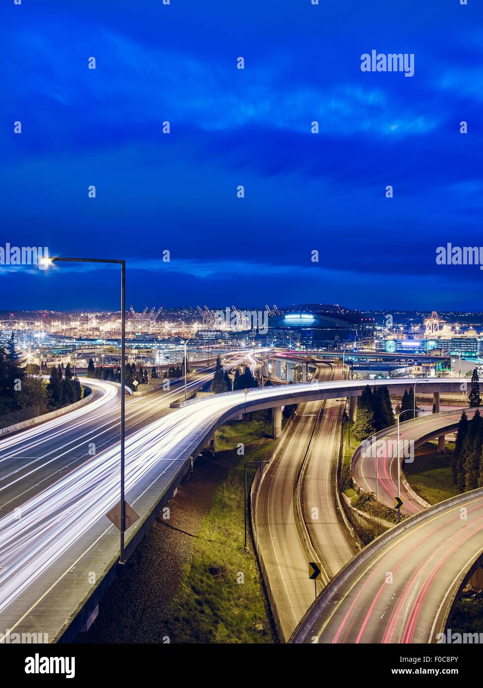 Traffic light trails on city flyover at night, Seattle, Washington ...