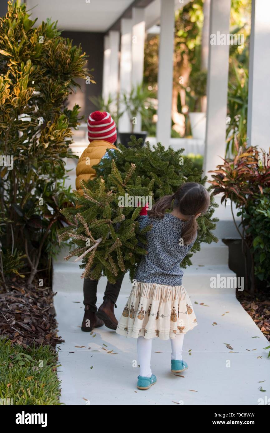 Boy carrying girl hi-res stock photography and images - Alamy