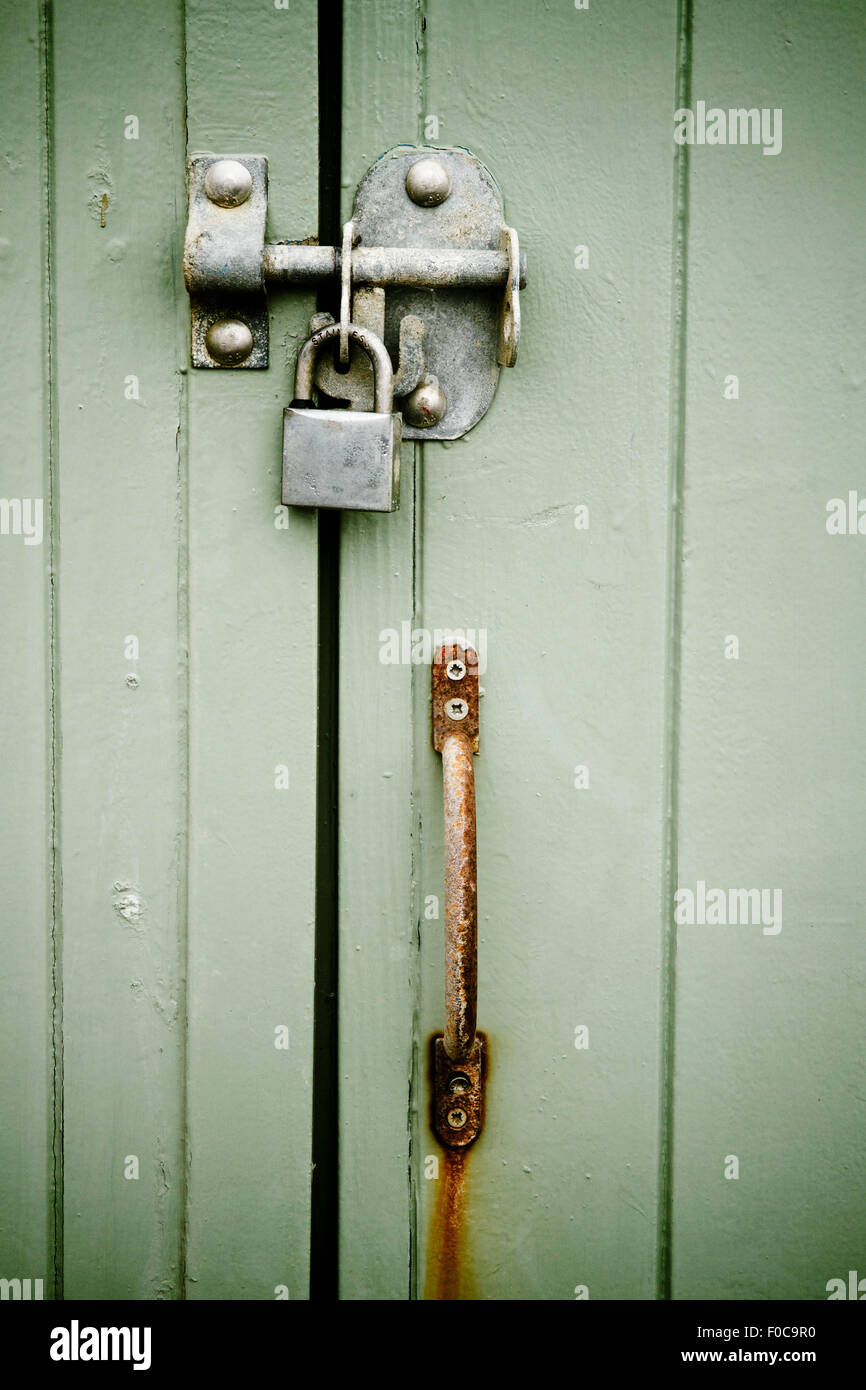 Padlock and handle Stock Photo - Alamy