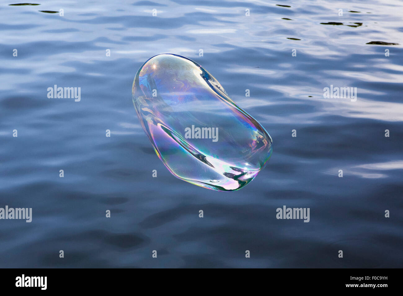 High angle view of bubble over water Stock Photo - Alamy