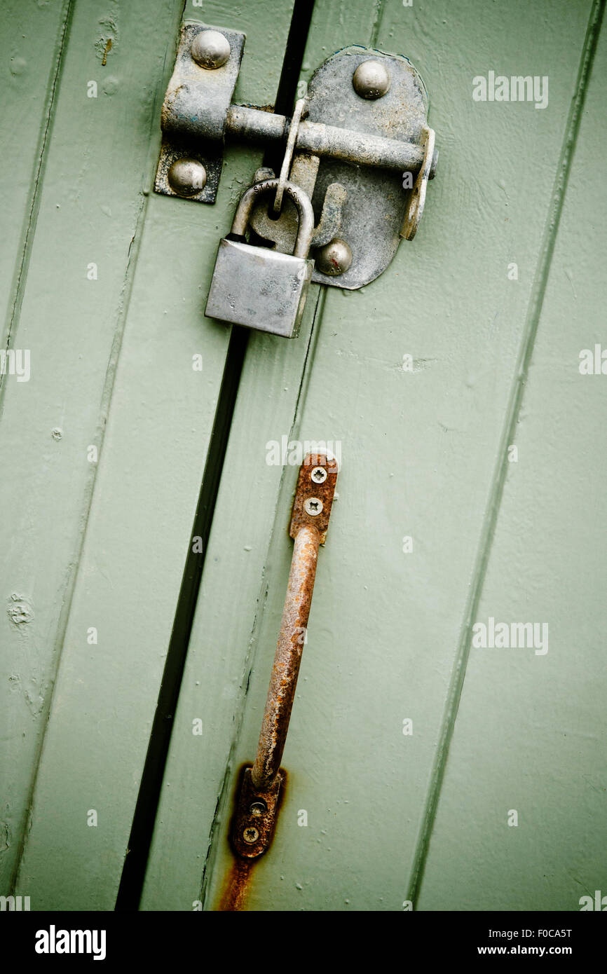 Padlock and handle Stock Photo - Alamy