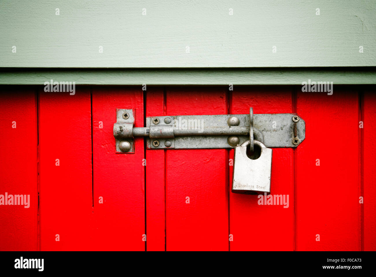 Padlock on red Stock Photo - Alamy