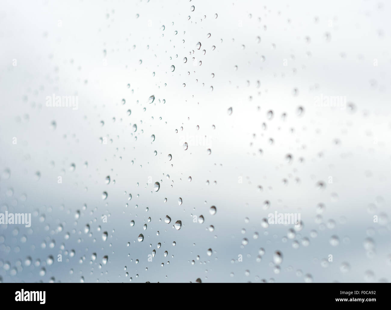 Raindrops on a glass Window Stock Photo - Alamy