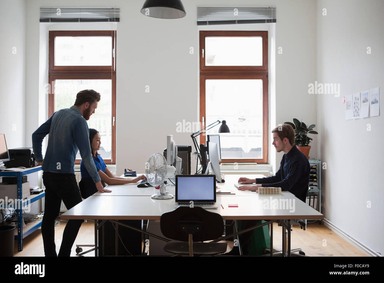Business people working at computer desk in office Stock Photo - Alamy