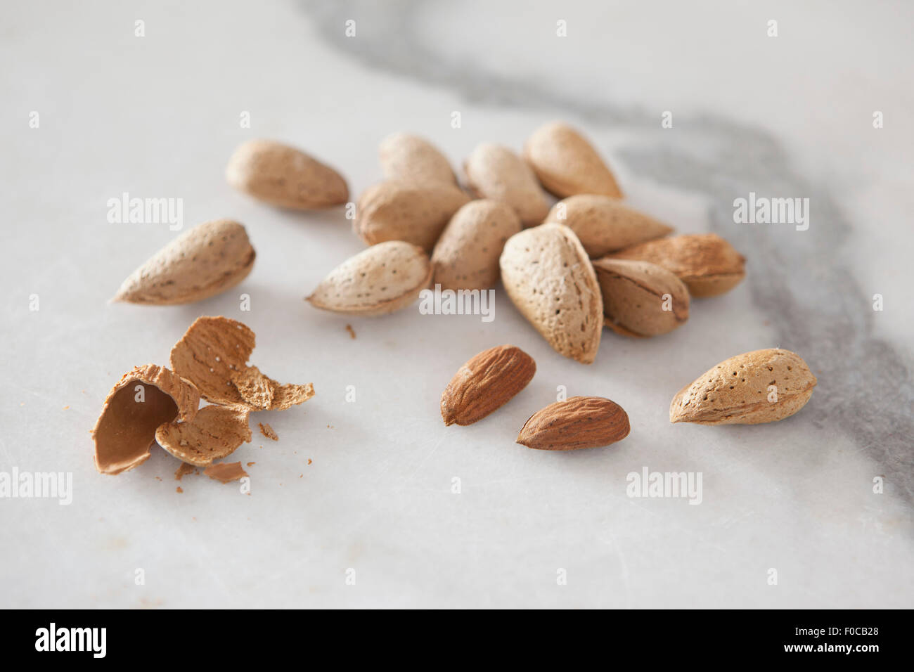 Close-up of almonds on white background Stock Photo - Alamy